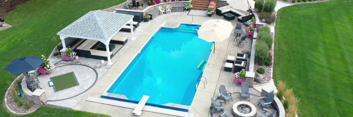 Multi-Functional Hardscape Around Pool by Carrington Lawn & Landscape